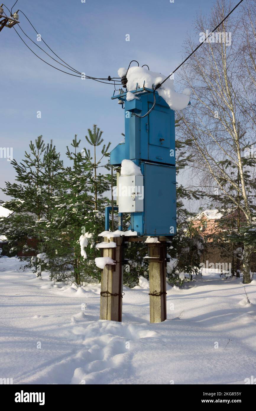 Transformer substation on outskirts of village, frosty and snowy winter ...