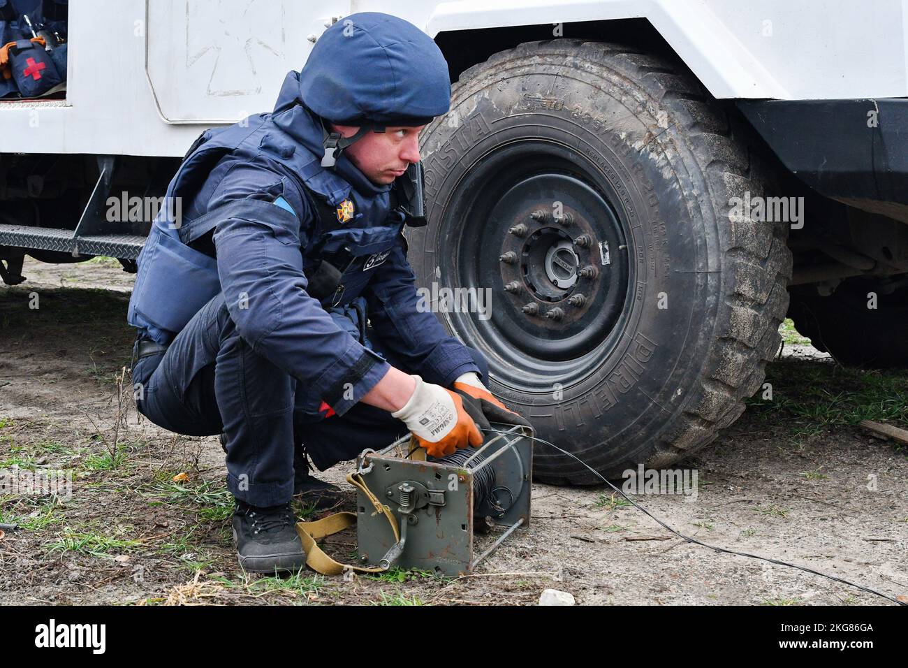 A Ukrainian sapper is seen preparing for the controlled undermining of ...