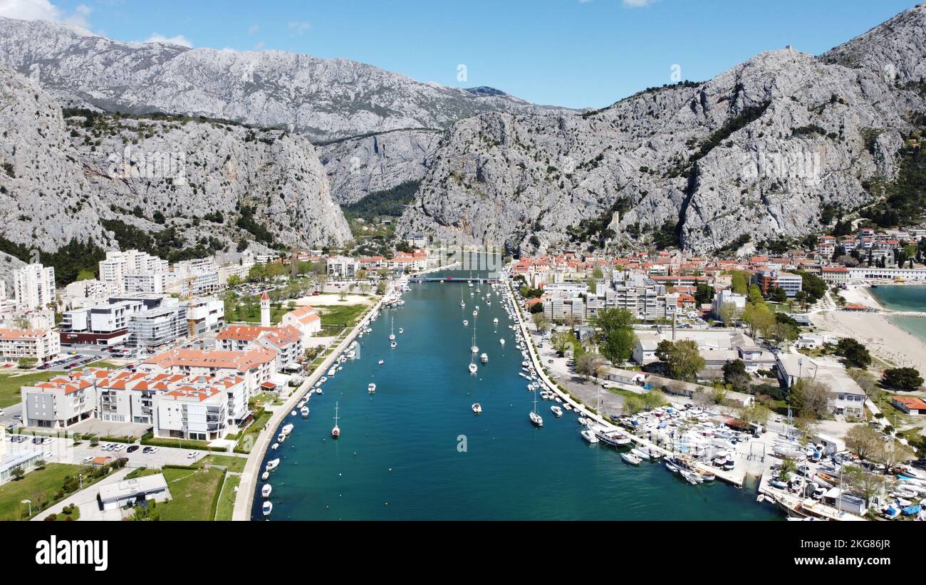 A breathtaking view of a small city next to a river and a hill Omis ...