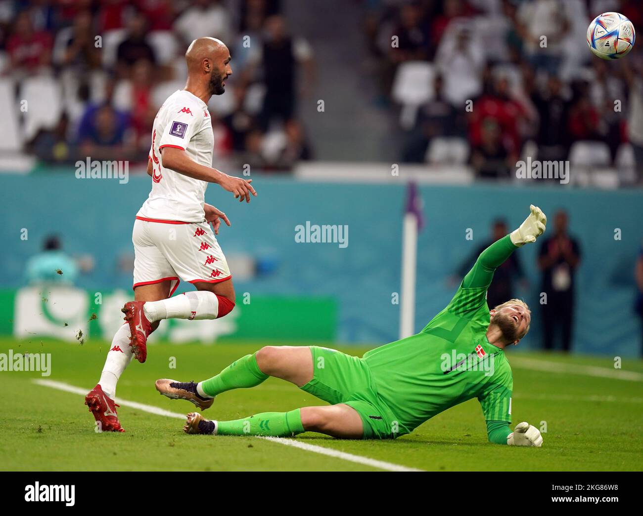 Denmark goalkeeper Kasper Schmeichel makes a save from Tunisia's Issam ...