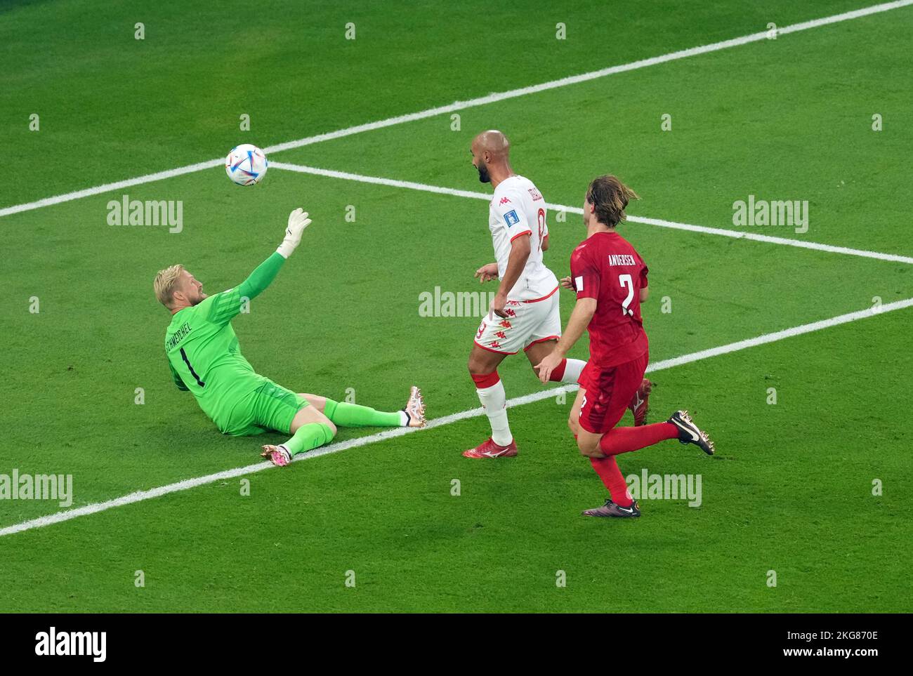 Denmark goalkeeper Kasper Schmeichel saves from Tunisia's Issam Jebali ...