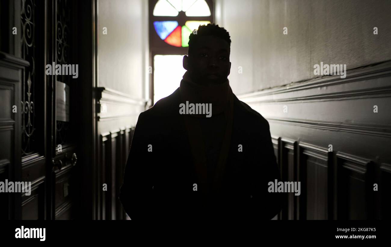 Person leaving home stepping outside, black man opening entrance door ...