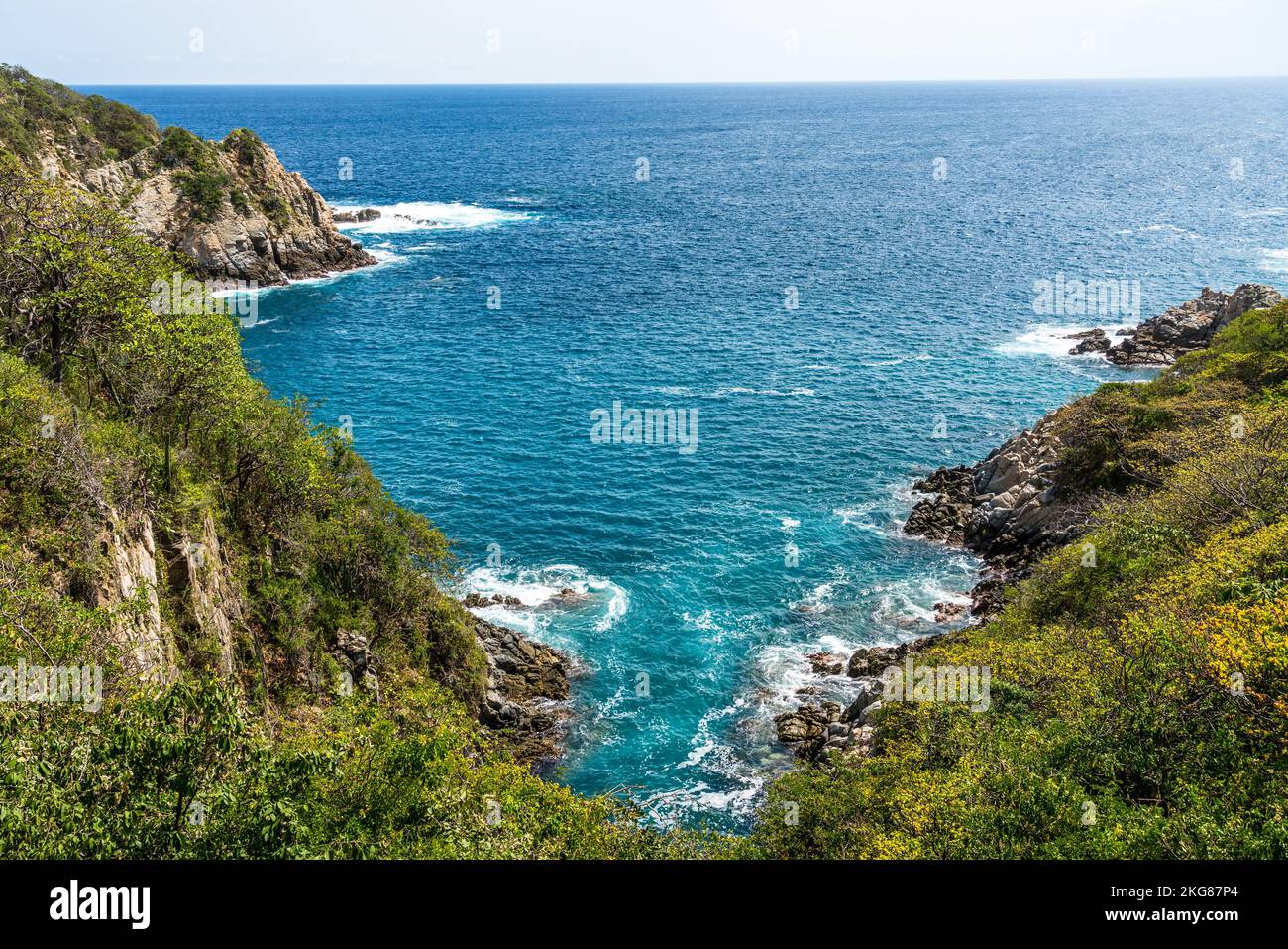 Playa Violin or Violin Bay and the rugged shoreline of Huatulco ...