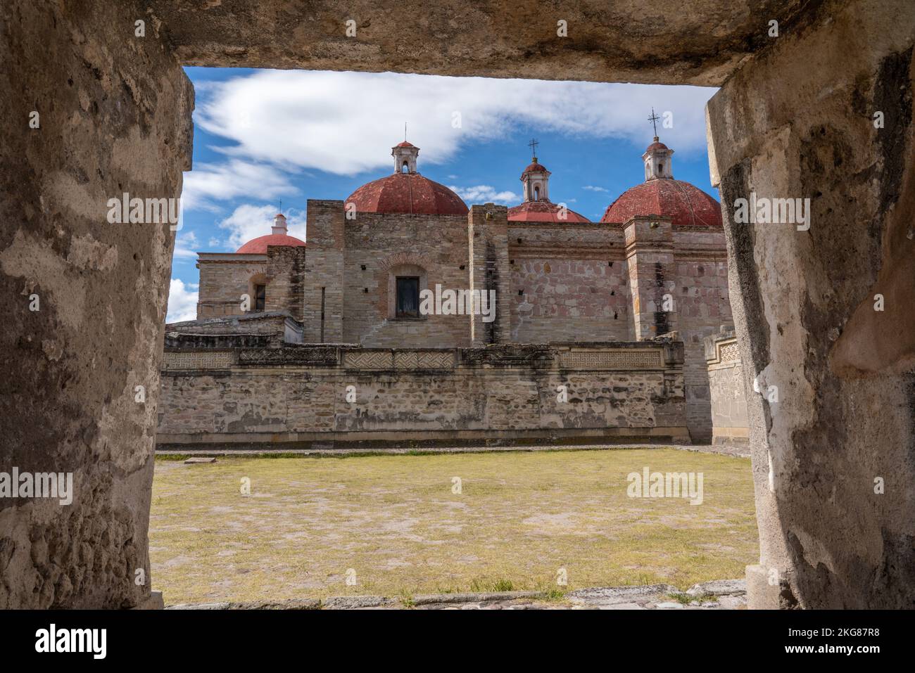 The Temple of San Pablo Apostol framed by pre-Hispanic Zapotec ruins in San Pablo Villa de Mitla ...