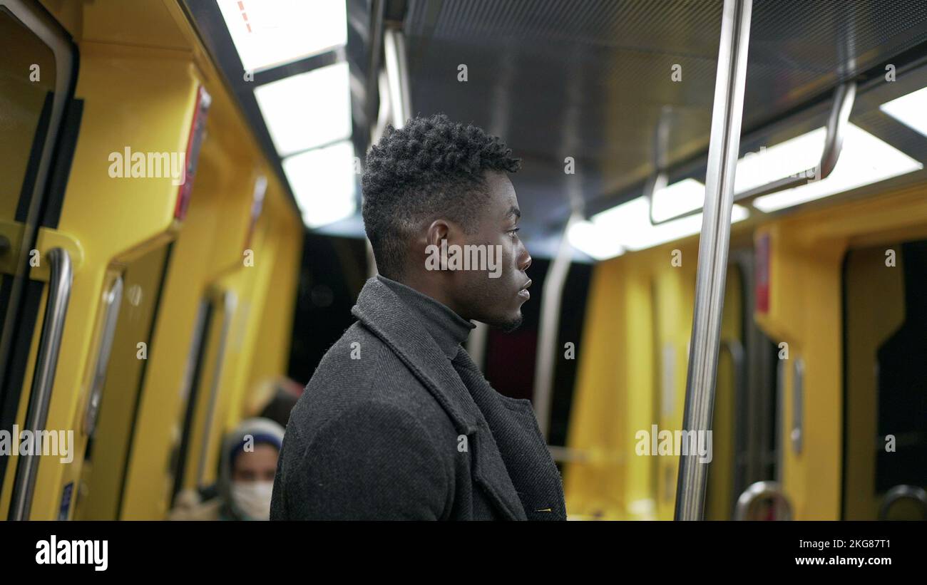 Portrait African man riding subway. Person commuting in underground ...