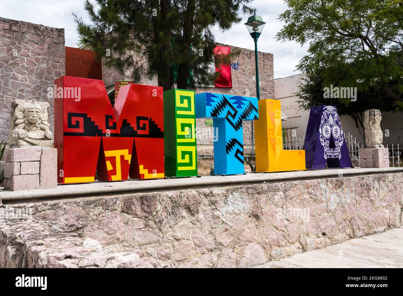 A colorful sign for San Pablo Villa de Mitla, Oaxaca, Mexico, flanked ...