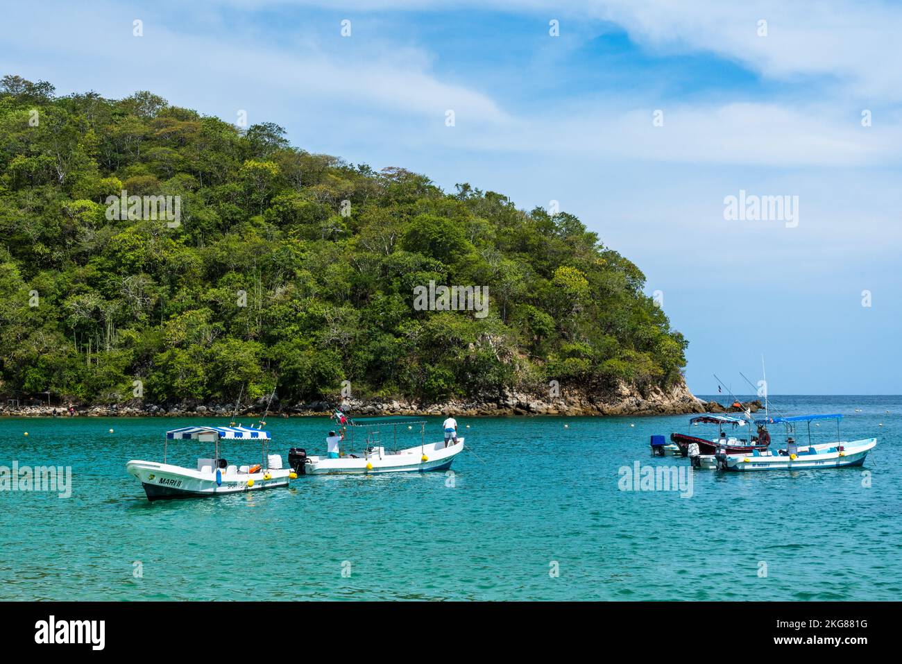 Tourists recreating on Maguey Beach in Huatulco National Park on the ...