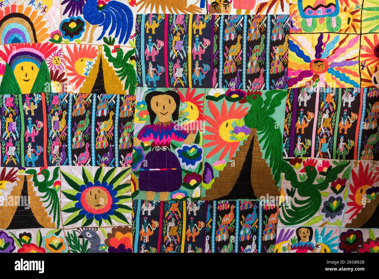 A hand-embroidered and hand-woven patchwork wall hanging in a hotel ...