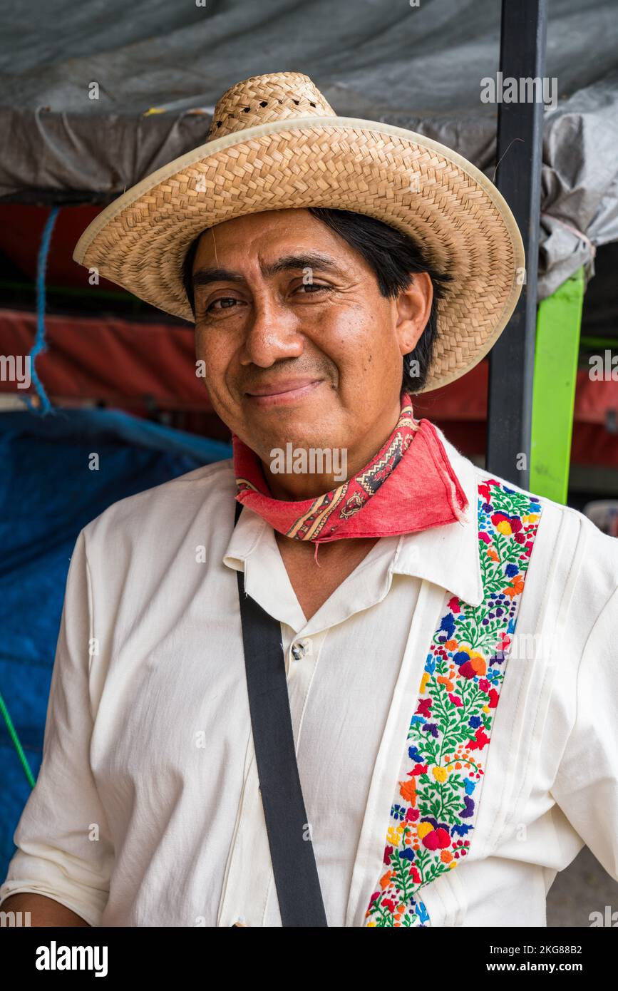 A man from the town of San Pablo Villa de Mitla wearing a colorful hand ...
