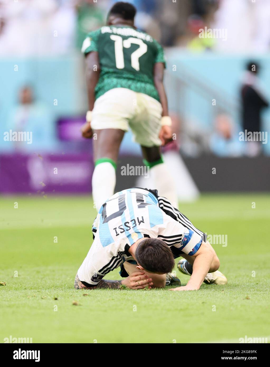 Lusail, Qatar. 22nd Nov, 2022. Lionel Messi of Argentina falls down ...