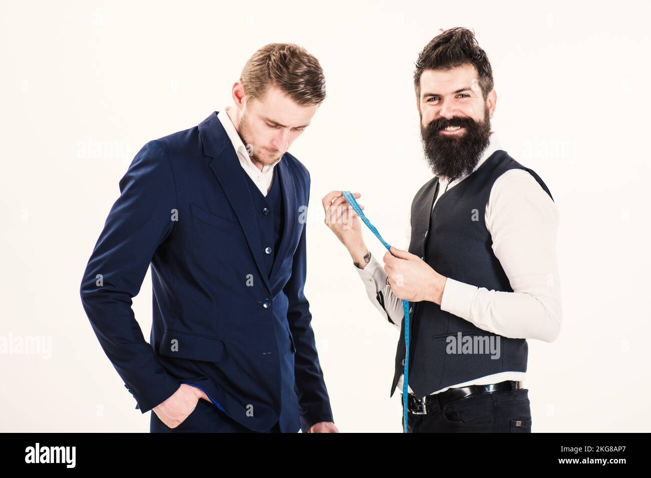 Businessman, client on strict face visit tailor salon Stock Photo - Alamy