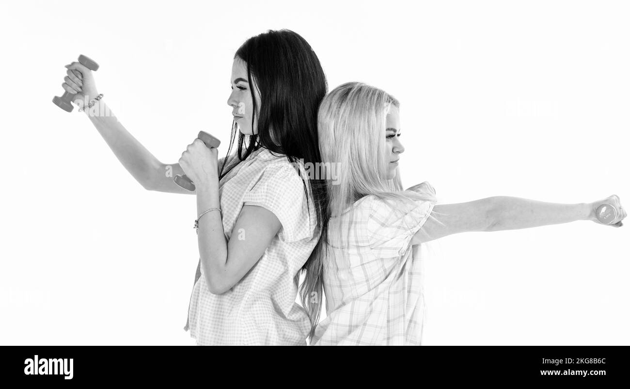 Sisters or best friends in pajamas do sport. Blonde and brunette on ...