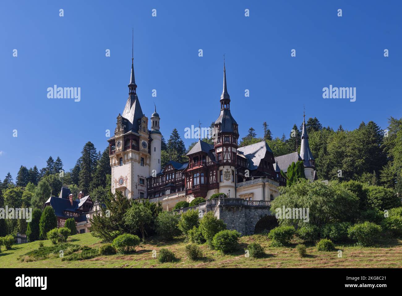 Peles Castle amongst other monuments, surrounded by pretty landscape ...