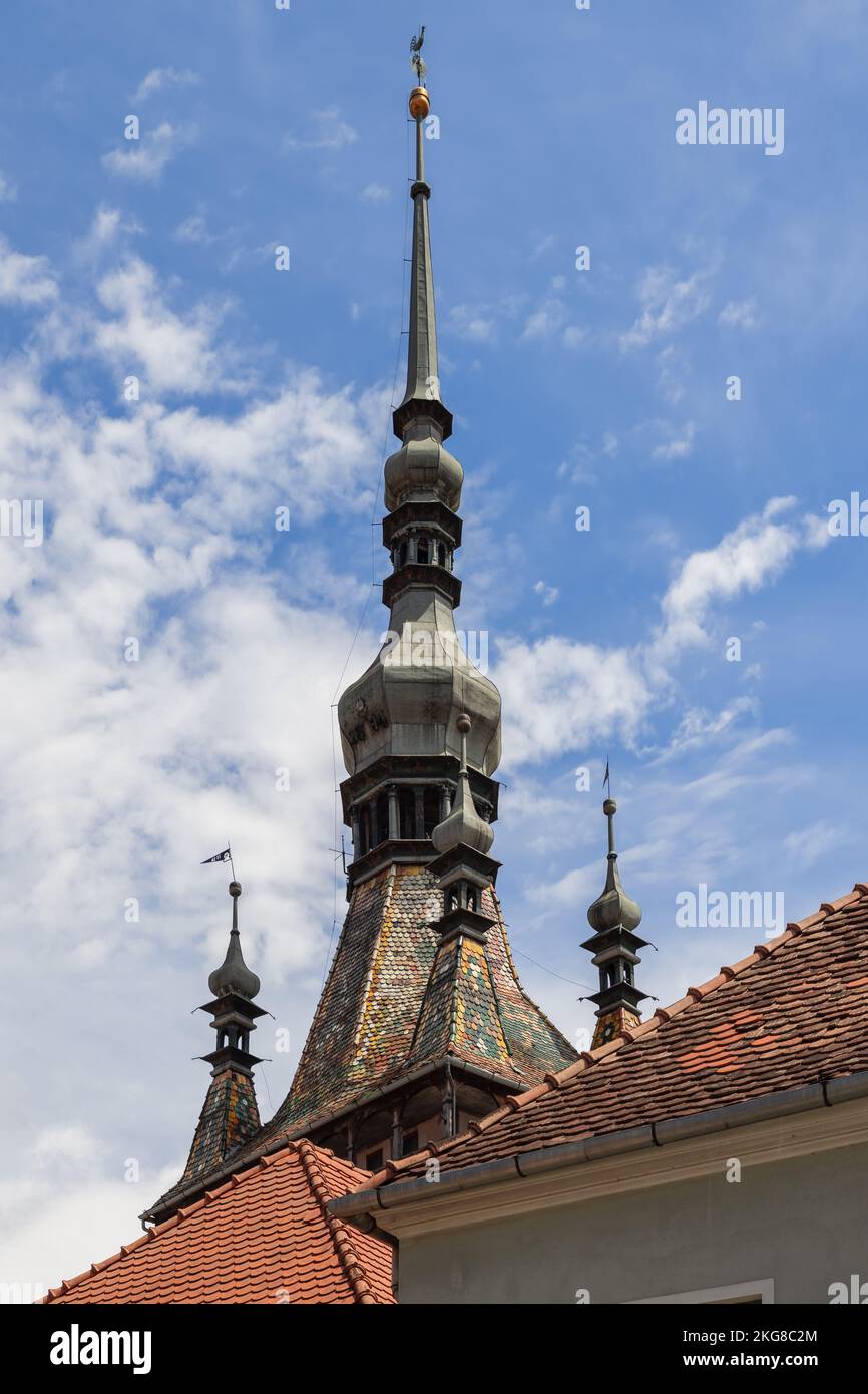 Gothic spiers with a weather vane soaring high into the sky above the ...