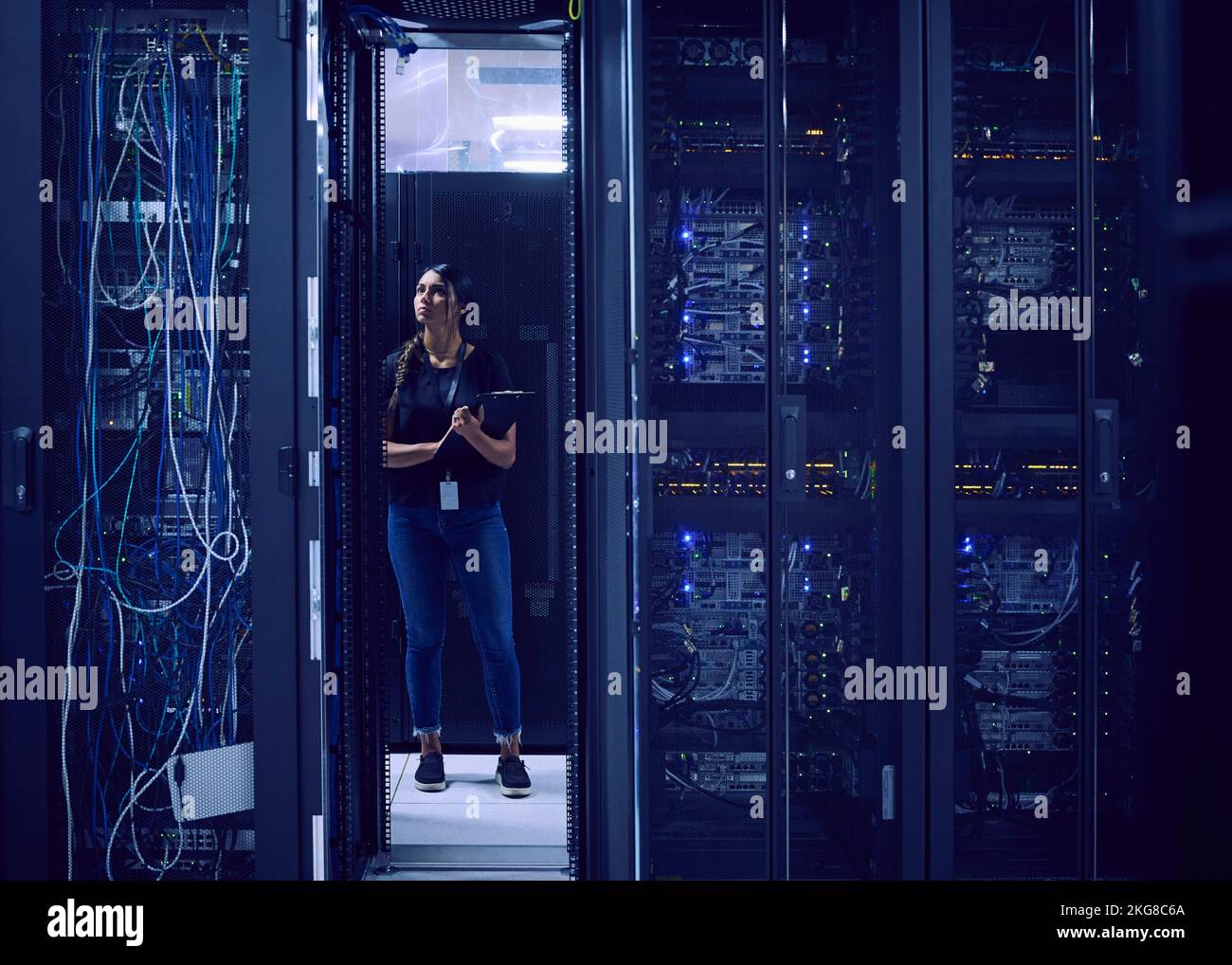 Female technician working in server room Stock Photo - Alamy