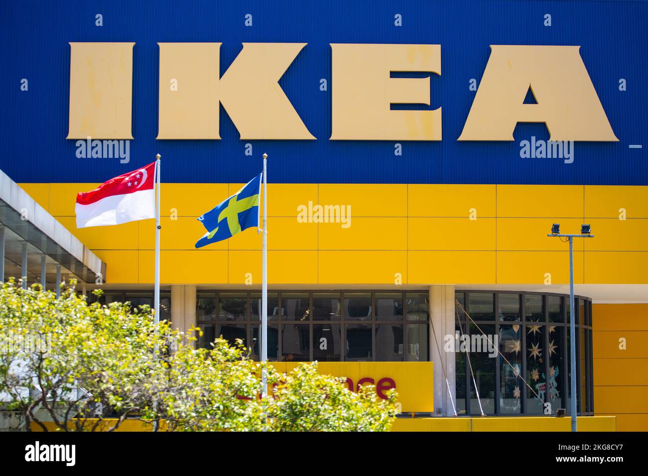 Close up of Ikea furniture building store, flag of Singapore and Sweden ...