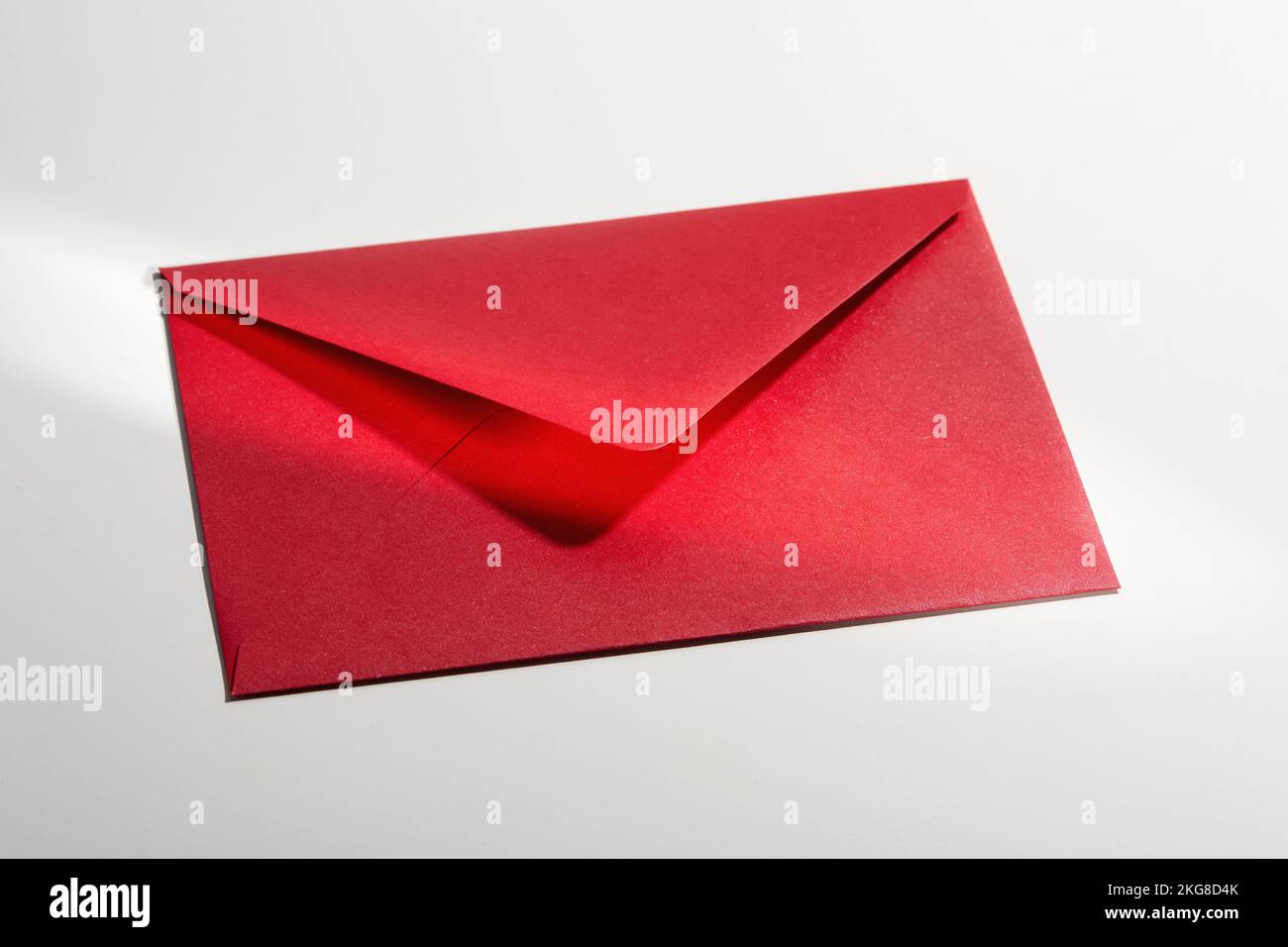 Red envelope on white background Stock Photo - Alamy