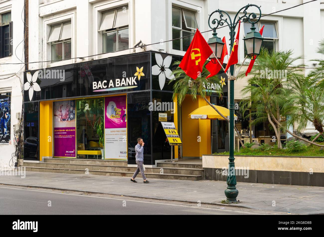 Front elevation of a Bac a Bank branch office with a passing pedestrian ...