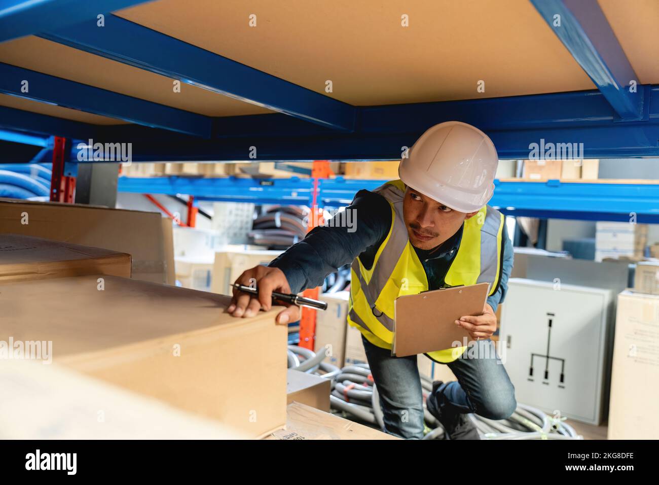 Asian man wearing reflective jacket holding checklist paper standing in ...