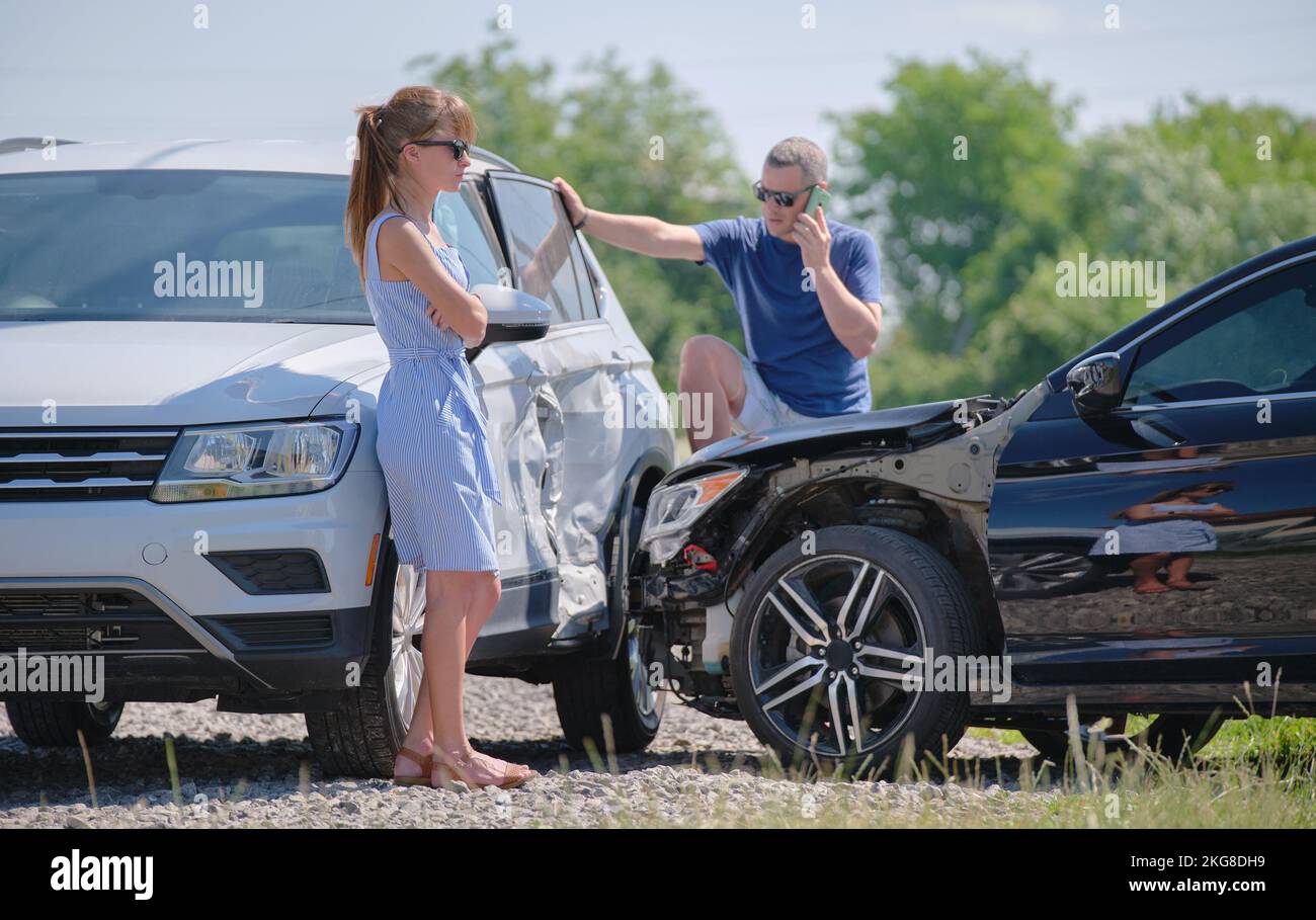 Drivers of smashed vehicles talking on cellphone calling for help in ...