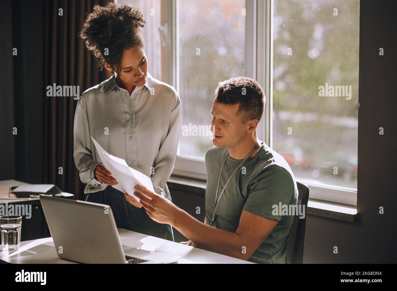Two young woman working with papers hi-res stock photography and images ...