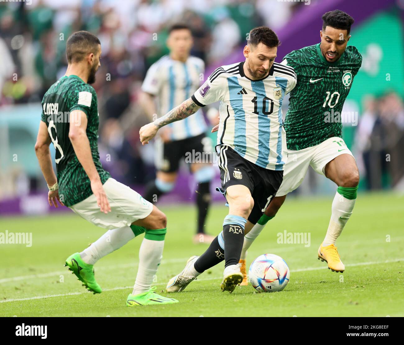 Lusail, Qatar. 22nd Nov, 2022. Lionel Messi (C) of Argentina vies with ...