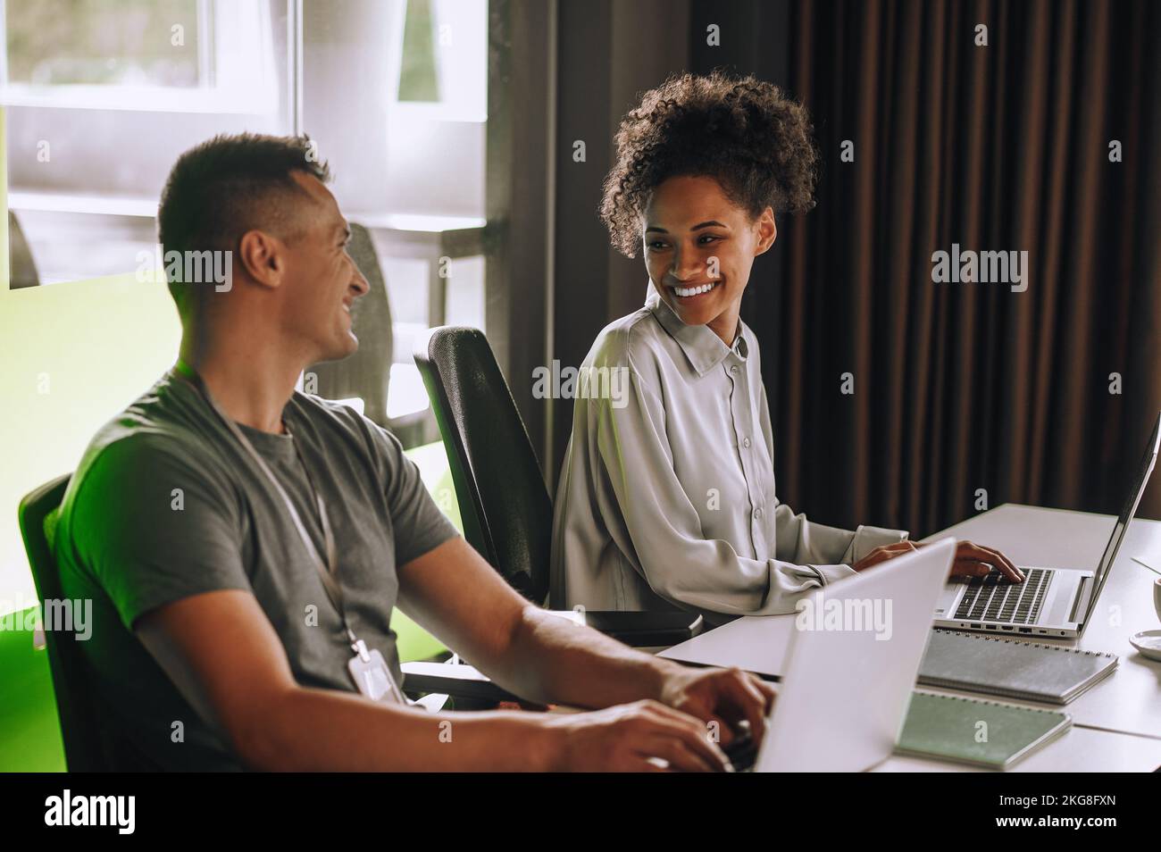 Joyful woman sitting table hi-res stock photography and images - Alamy