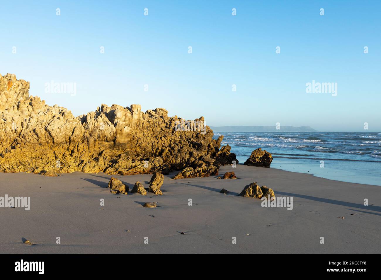 South Africa, Hermanus, Blue sky above Voelklip Beach and sea Stock ...
