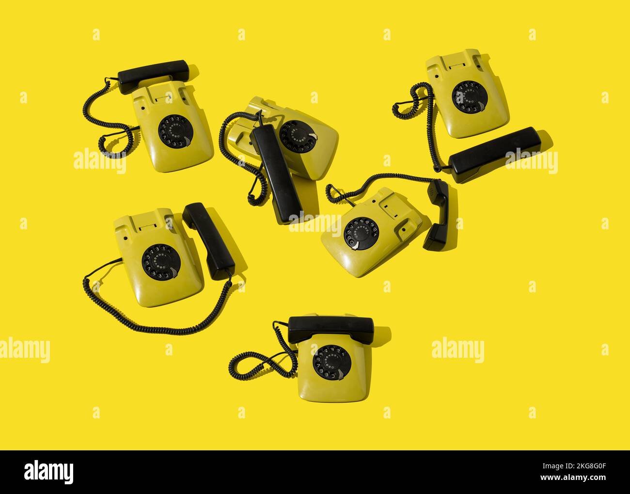 Retro yellow landline rotary telephones. Communication background Stock ...