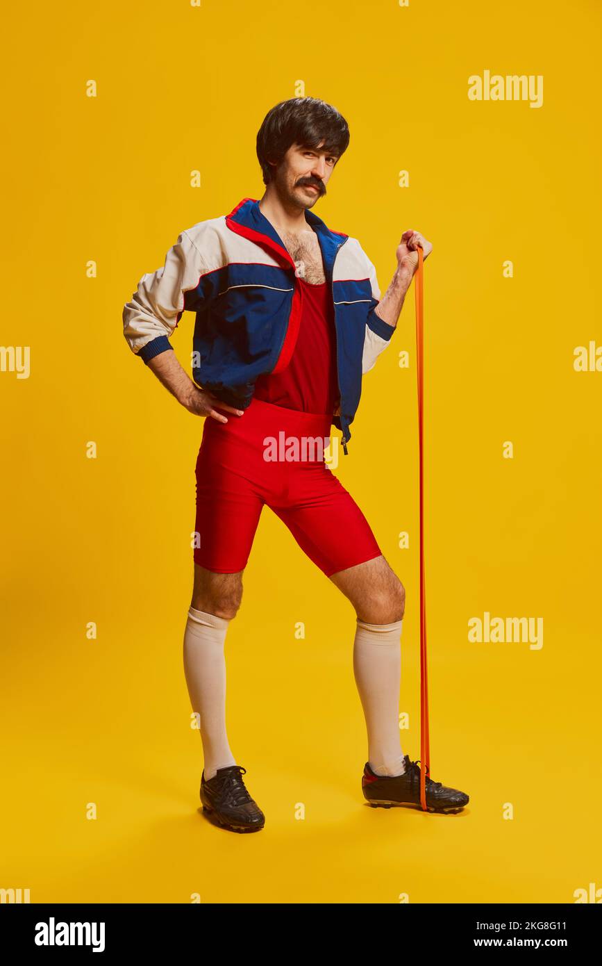 Portrait of stylish man with moustache posing in vintage sportswear ...