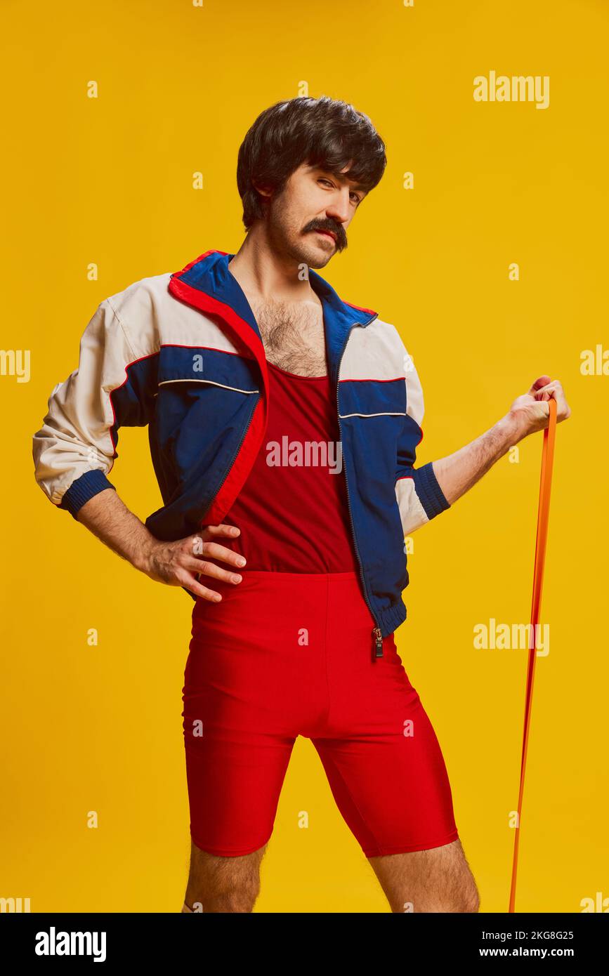Portrait of stylish man with moustache posing in vintage sportswear ...