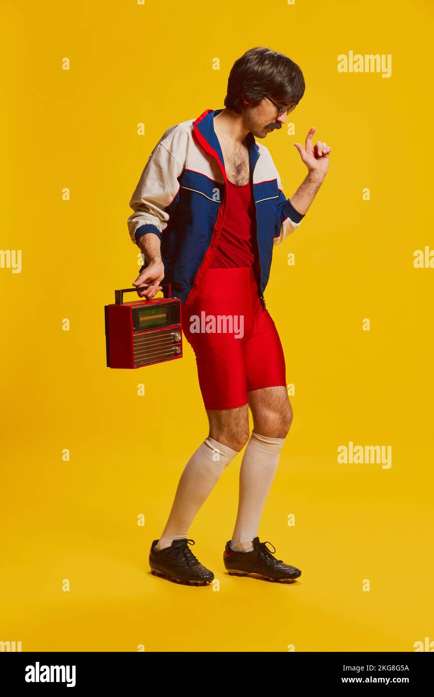 Portrait of man with moustache posing in vintage sportswear and red ...