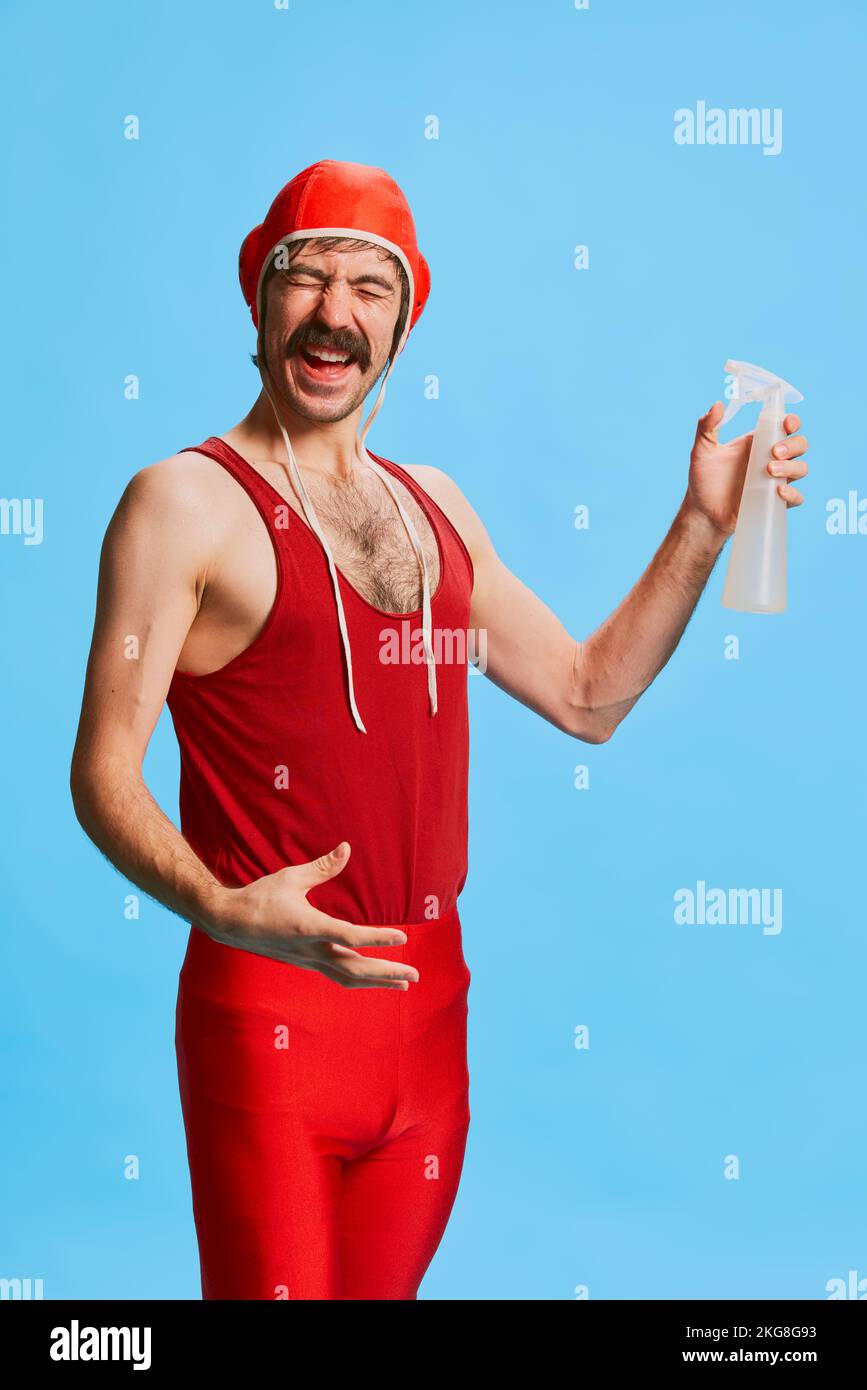 Portrait of stylish man with moustache posing in vintage swimsuit ...