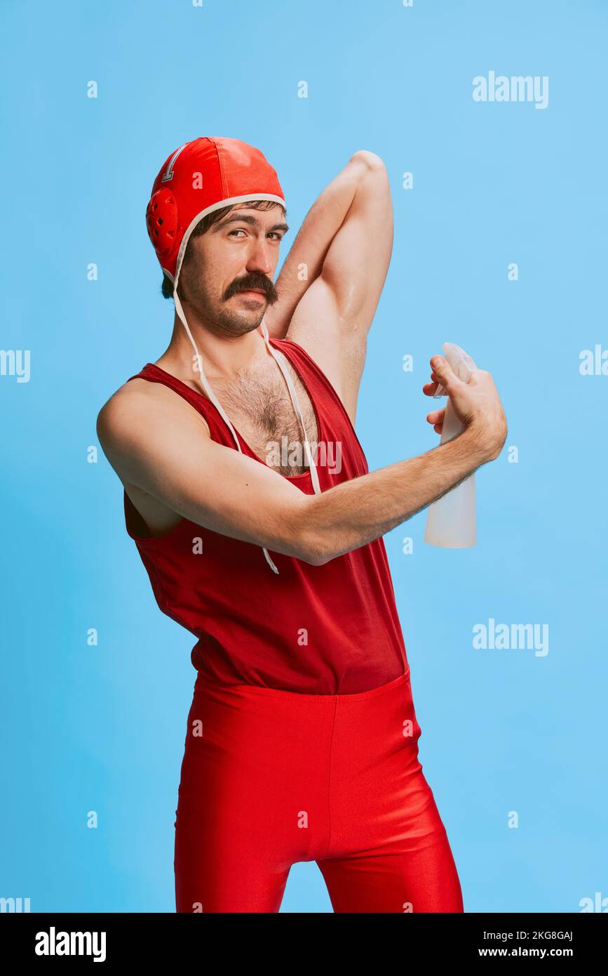 Portrait of stylish man with moustache posing in vintage swimsuit ...