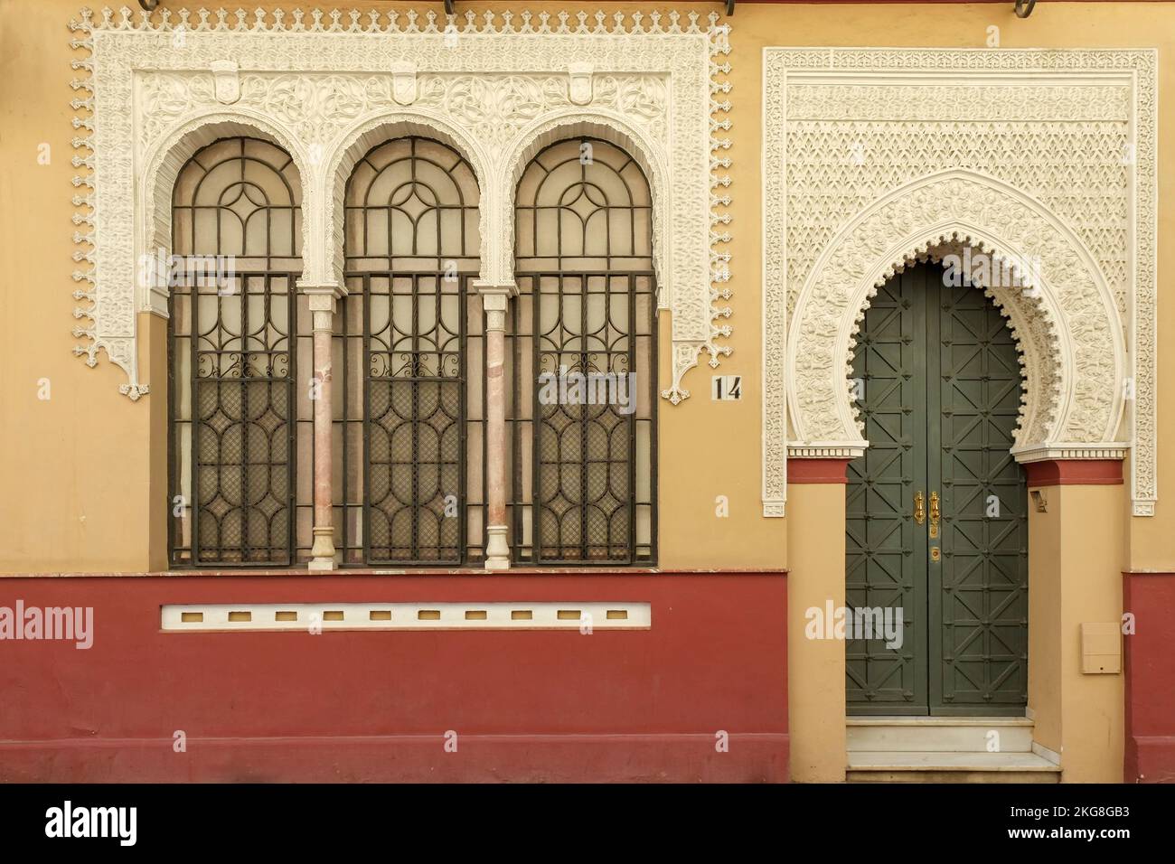 Spain, Seville, Moorish style building with arched entrance and windows ...