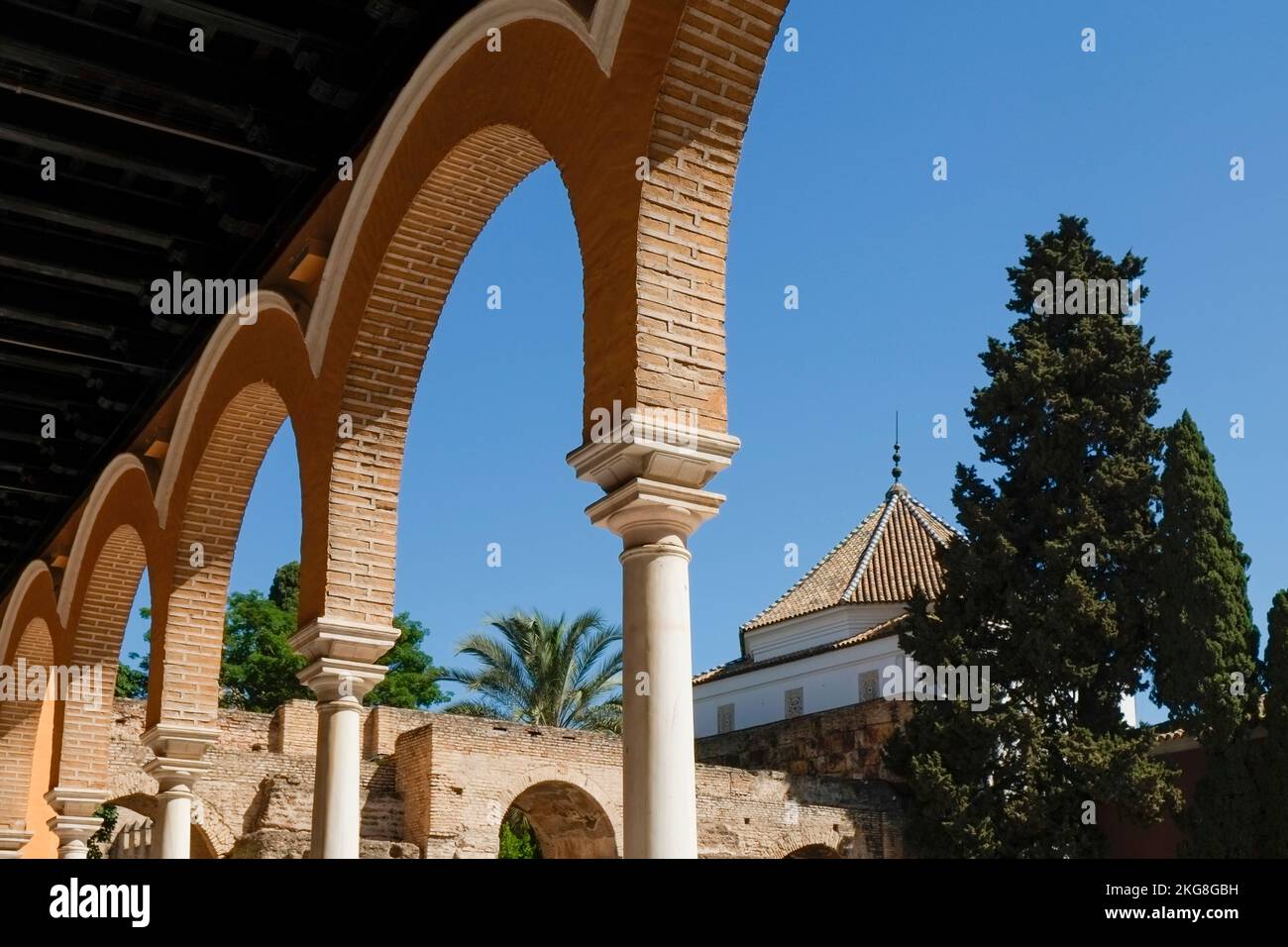 Spain, Seville, Arched gallery at royal palace Stock Photo - Alamy