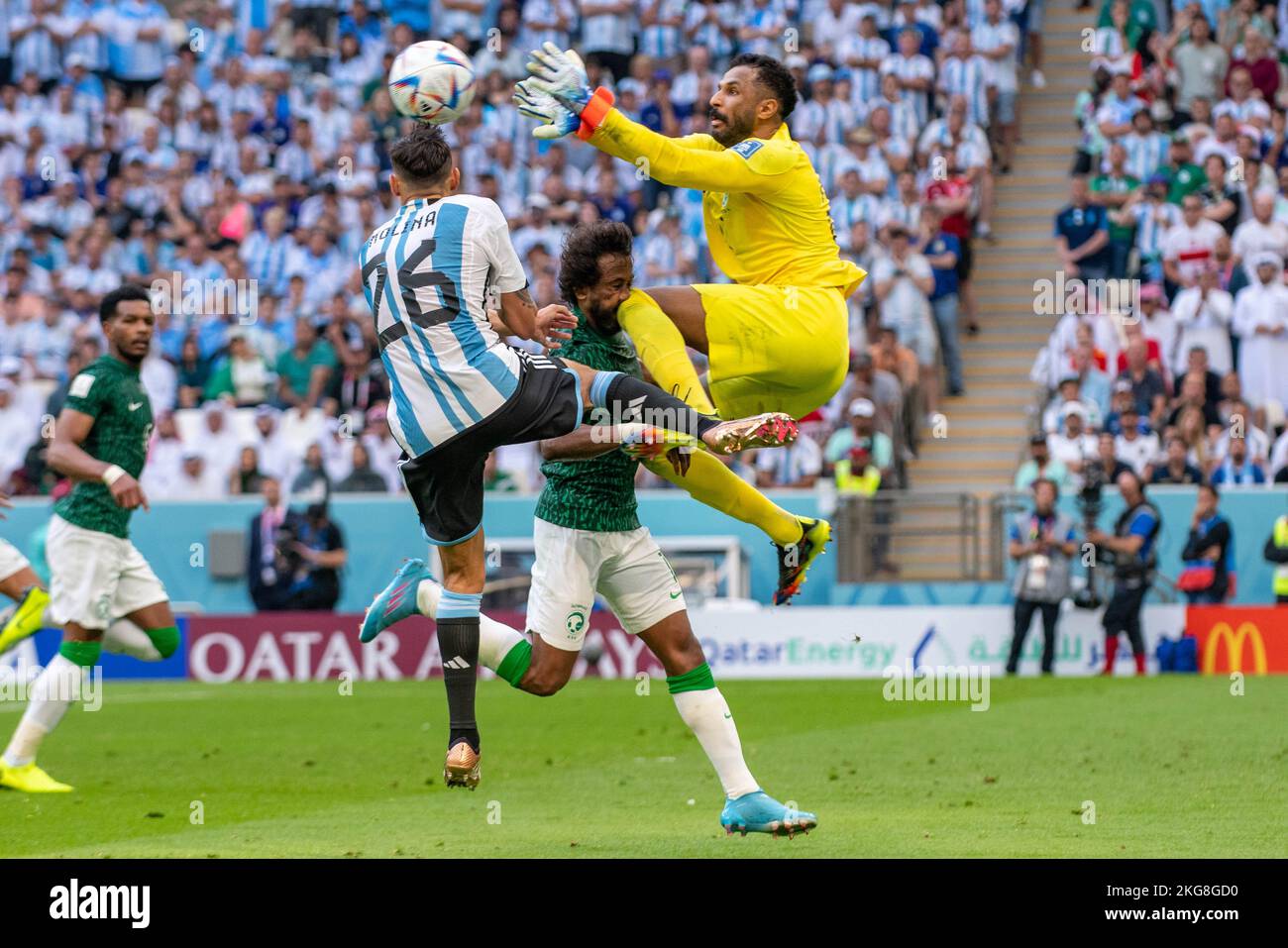 YASSER ALSHAHRANI of Saudi Arabia fouled by goalkeeper MOHAMMED ALOWAIS ...