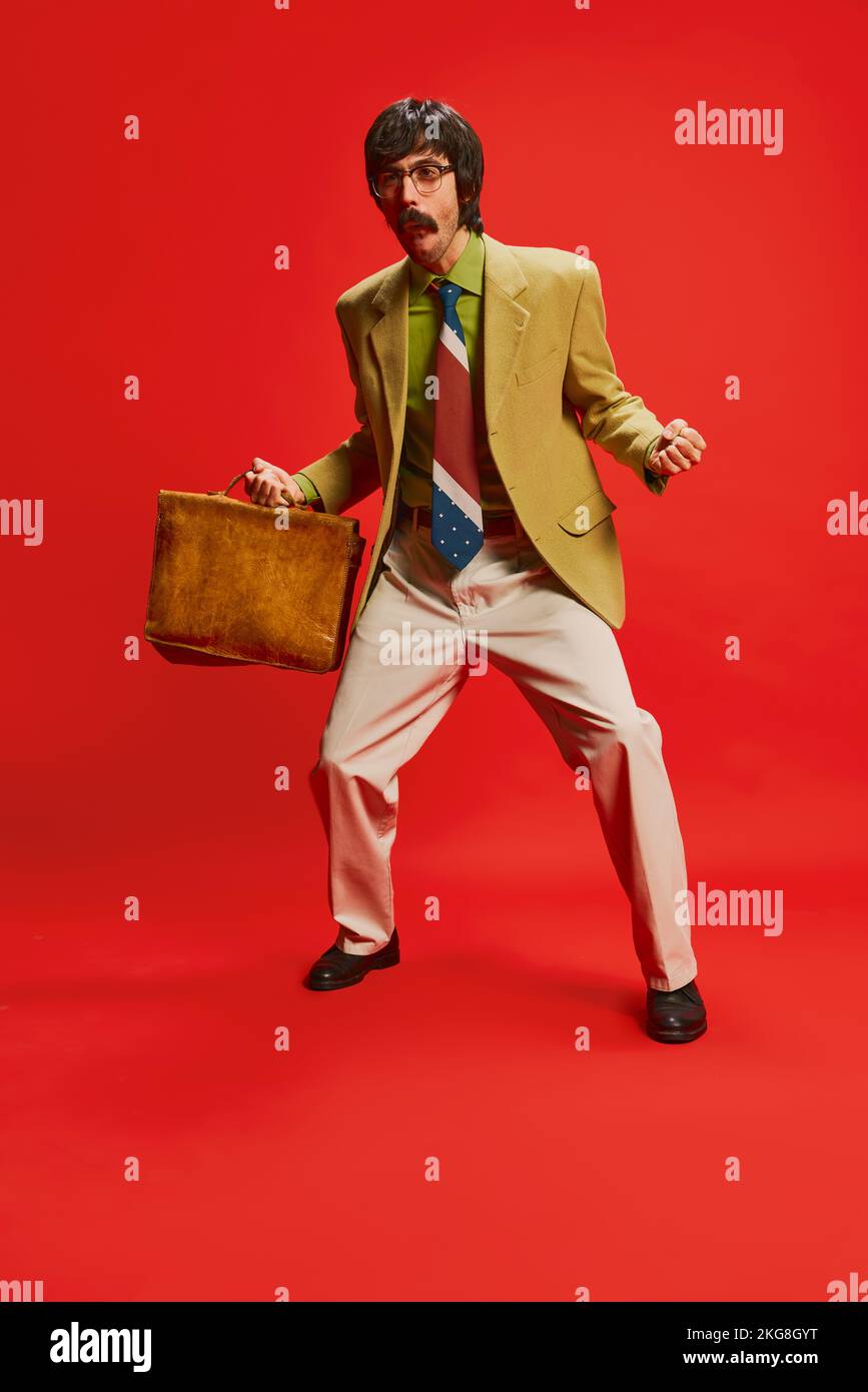 Portrait of stylish man with moustache posing in vintage suit isolated ...