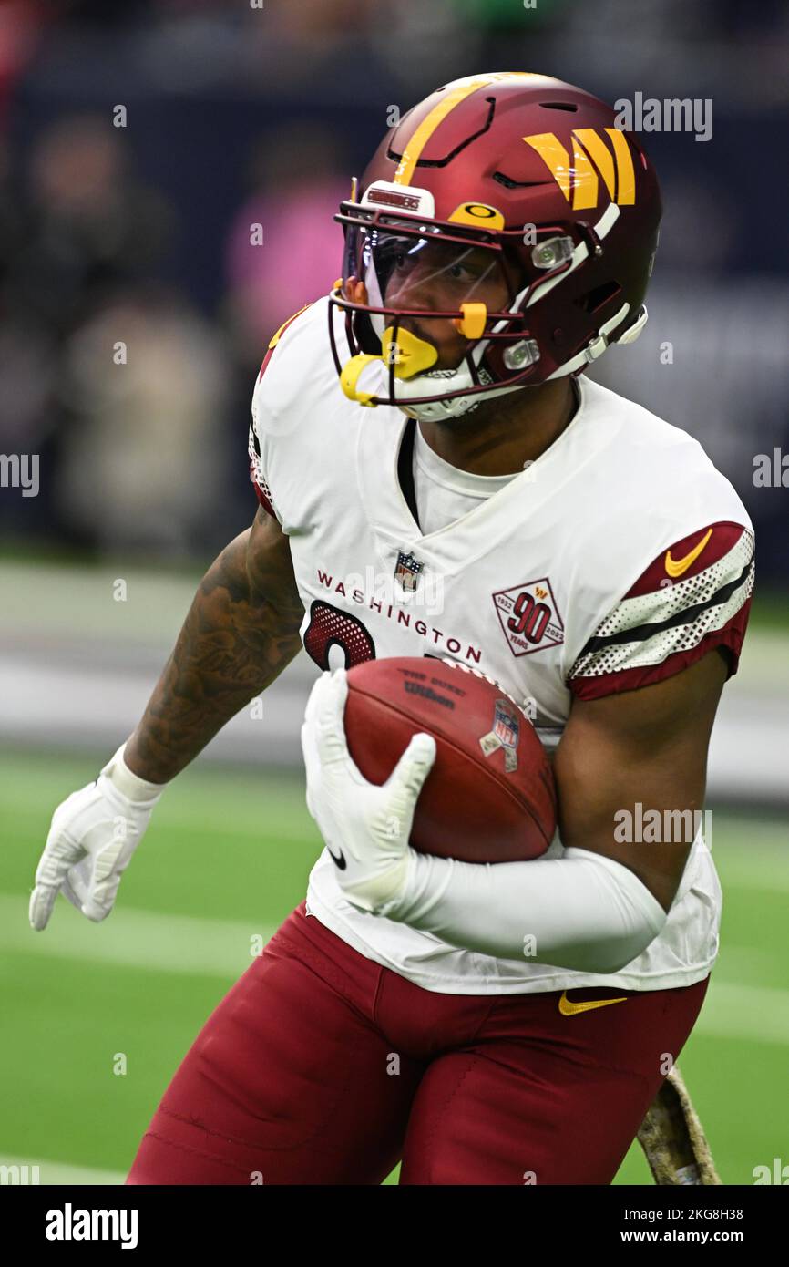 Washington Commanders running back Antonio Gibson (24) returns a kickoff during the NFL Football ...
