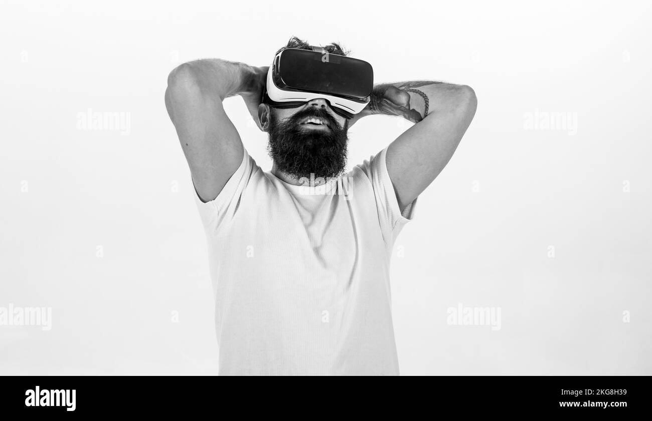 Man with beard in VR glasses enjoy watching video, white background ...