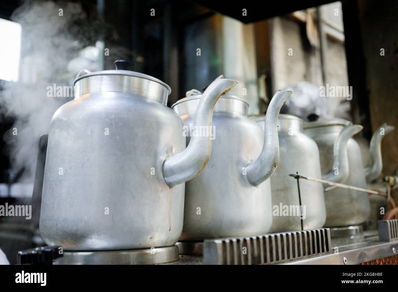 Kettles in old local hookah bar Stock Photo - Alamy
