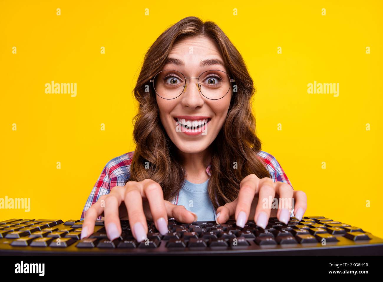 Photo of excited impressed girl with wavy hairdo dressed checkered ...