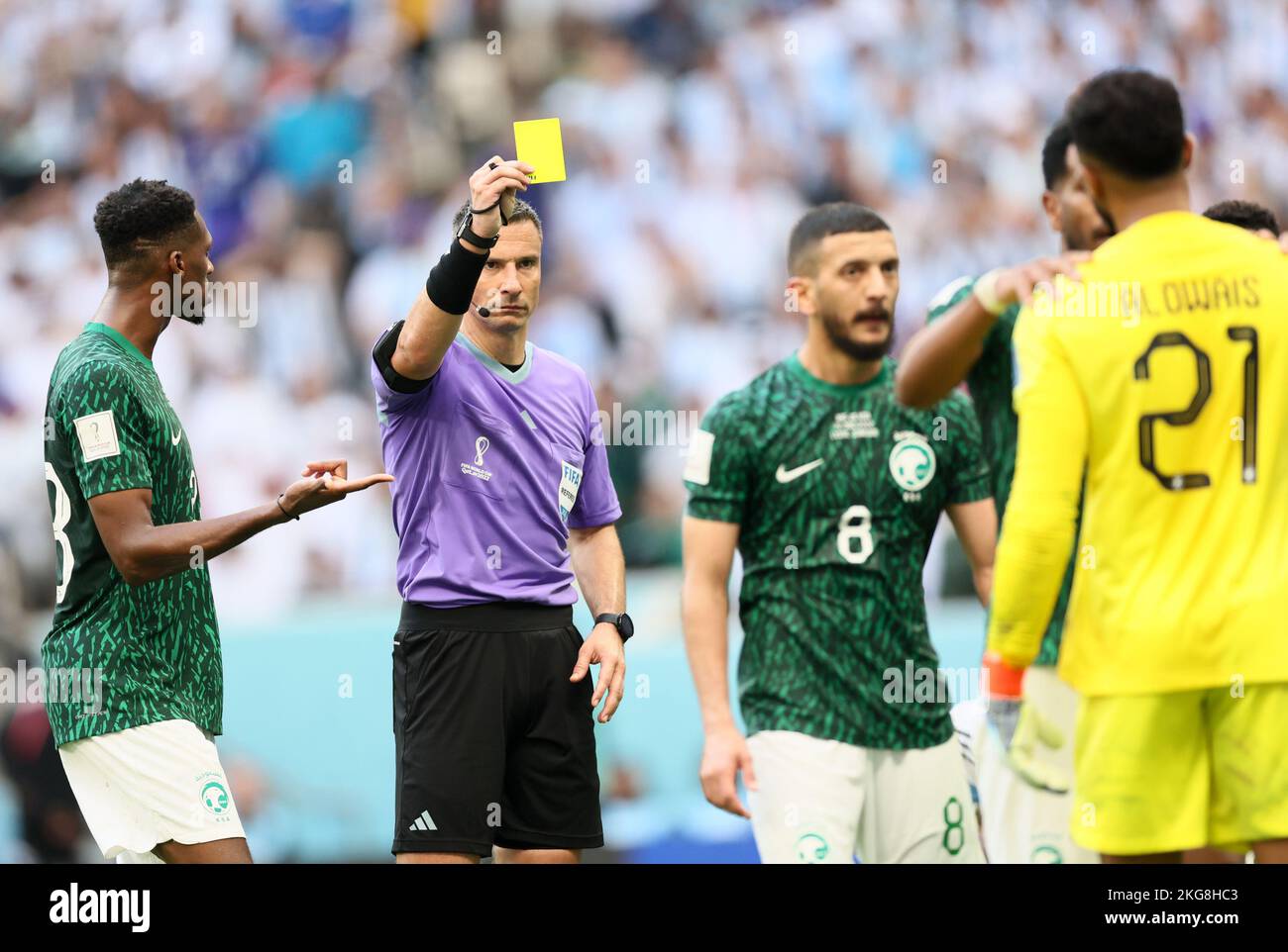 Lusail, Qatar. 22nd Nov, 2022. Referee Slavko Vincic (2nd L) shows a ...