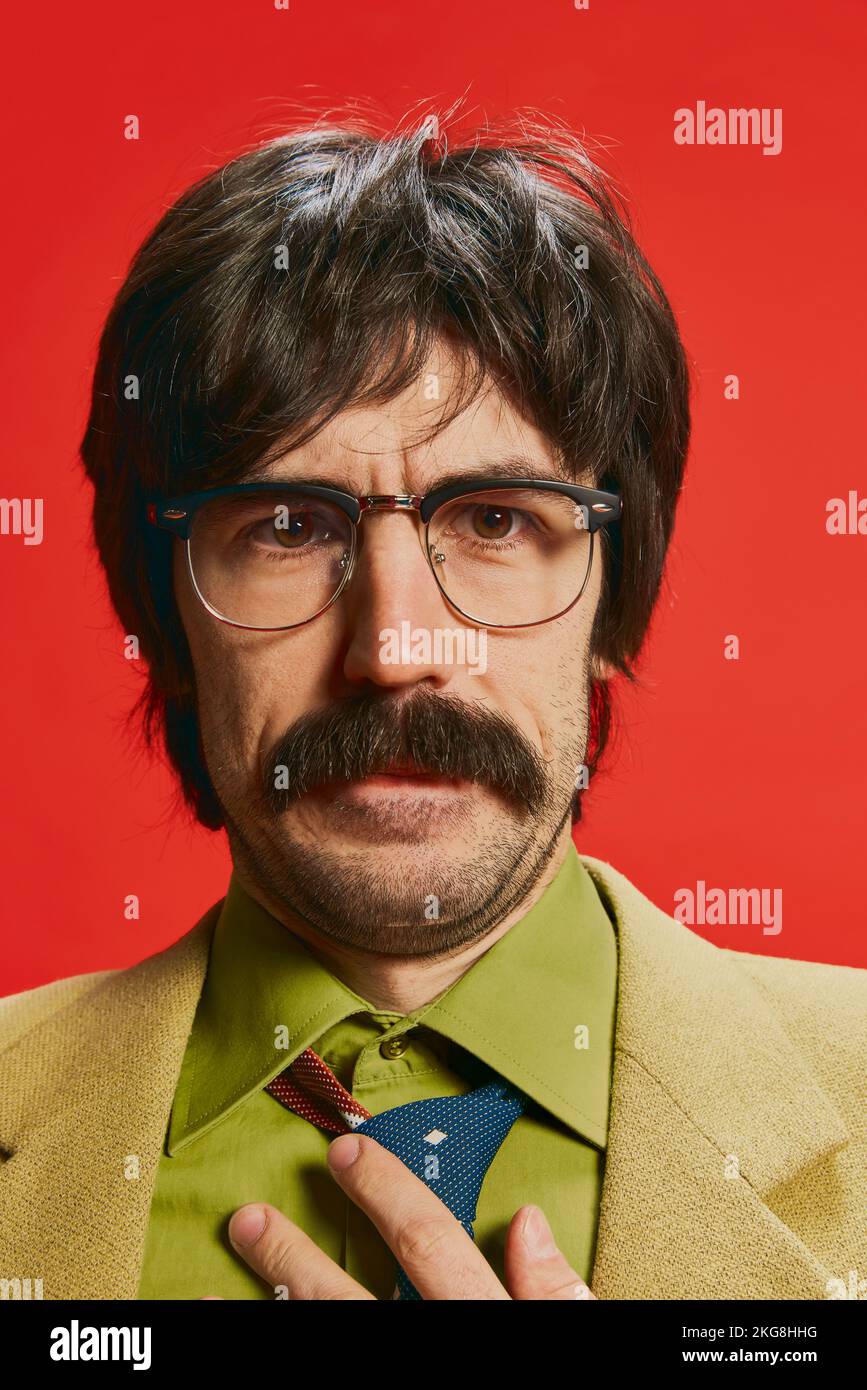 Close-up portrait of man with moustache posing in vintage suit and ...