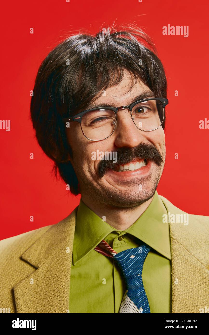 Close-up portrait of man with moustache posing in vintage suit and ...