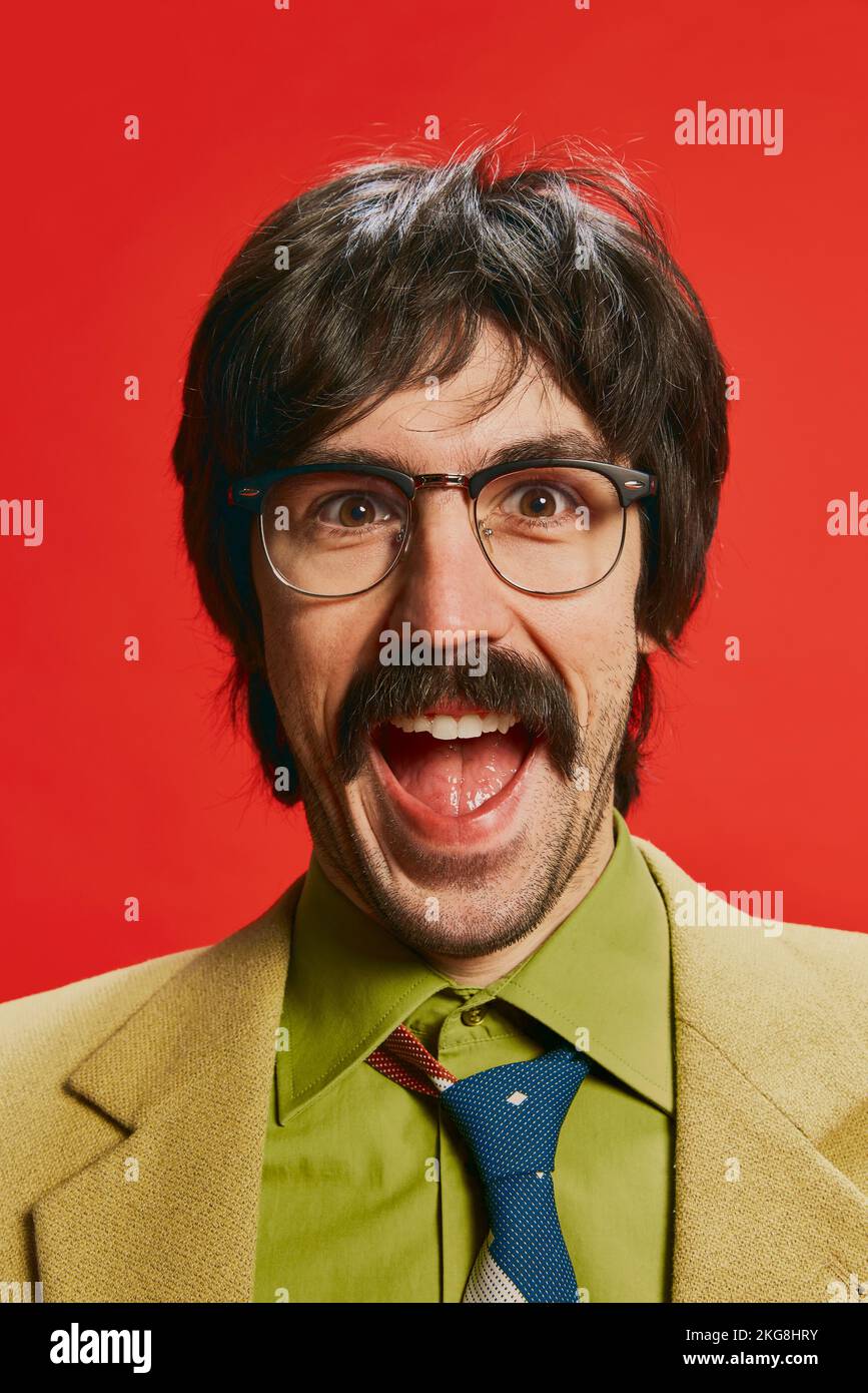 Close-up portrait of man with moustache posing in vintage suit and ...