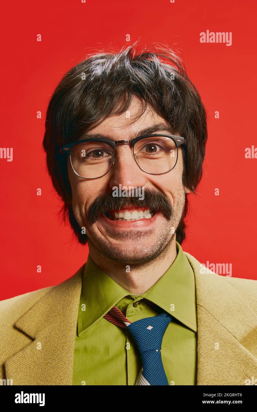 Close-up portrait of man with moustache posing in vintage suit and ...