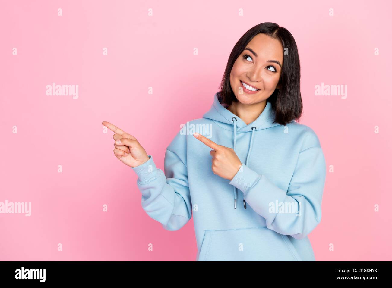 Photo portrait of cute young lady point empty space look dreamy ...