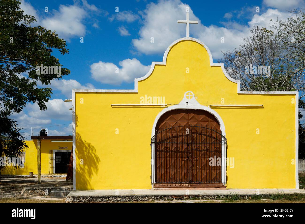 Mexico, Yucatan, Small yellow church exterior with wooden door Stock ...