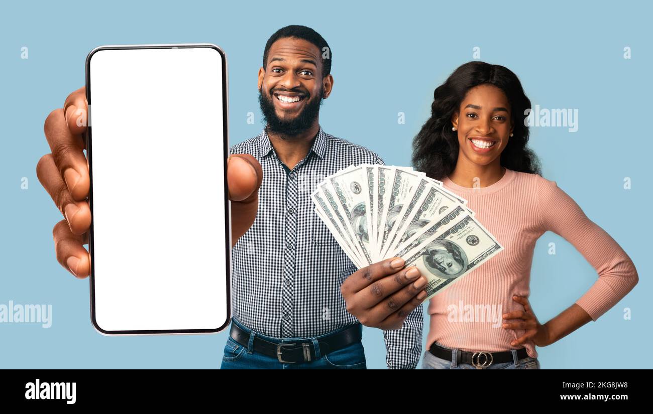 Happy black couple showing cash and cell phone, mockup Stock Photo - Alamy